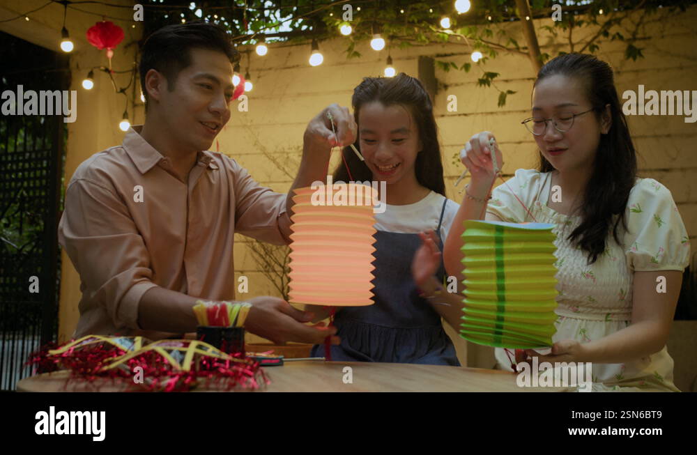 Parents and Daughter Making Lanterns for Mid-autumn Festival in ...