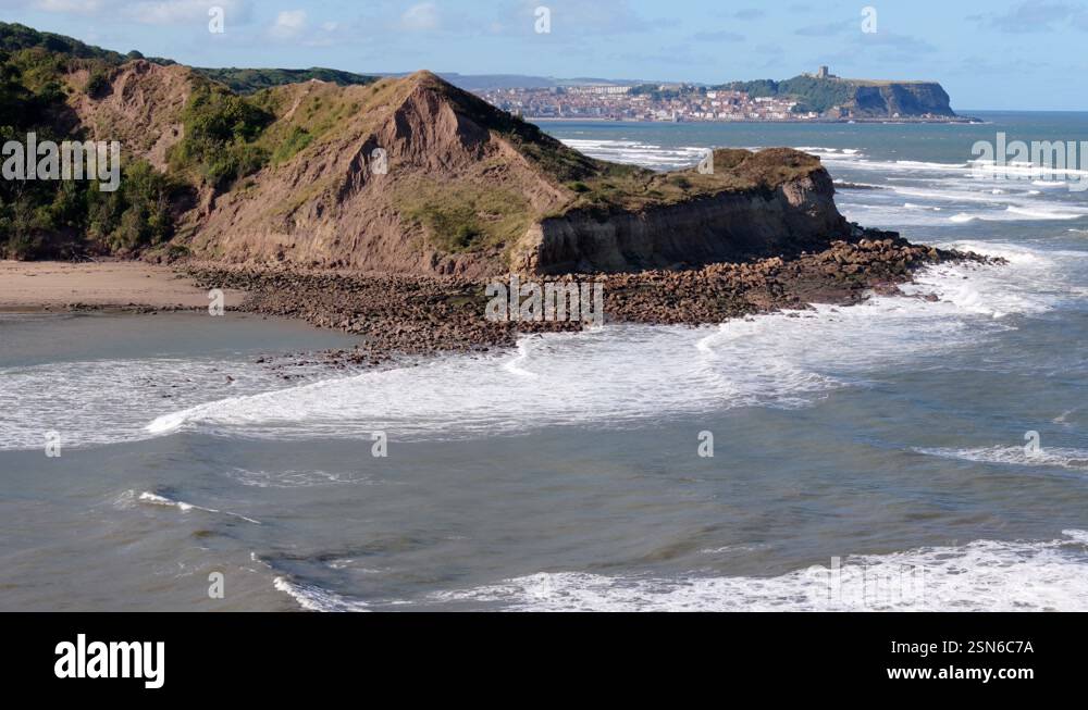 aerial drone footage of Scarborough taken from a distance away over ...