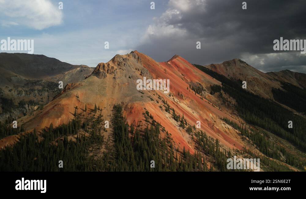 Aerial of lit up Red Mountain on Red Mountain pass in Ouray Colorado at ...