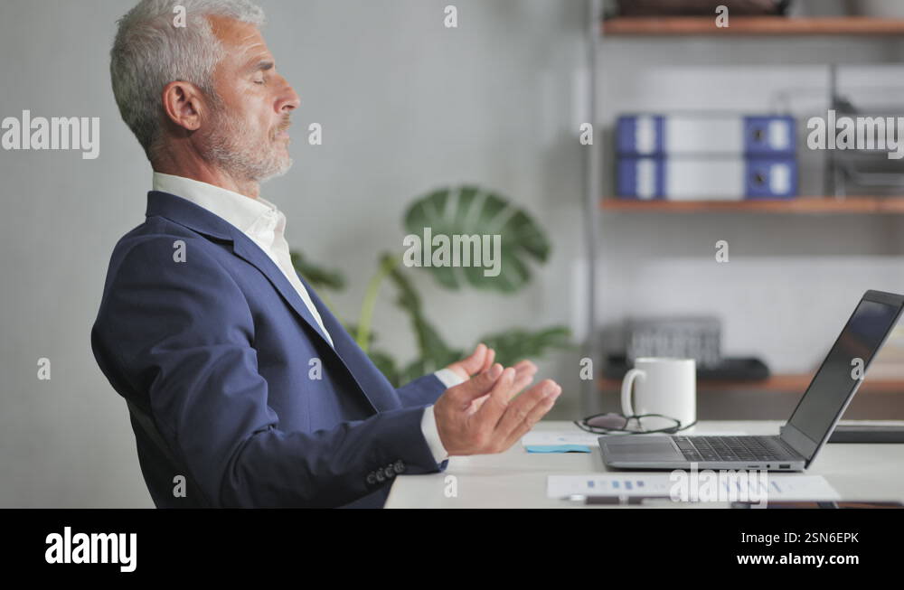 stress relief at workplace business man meditates at work in office ...