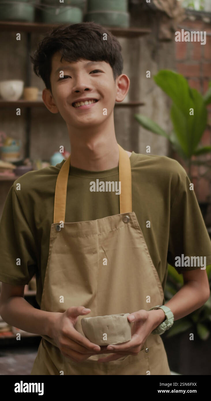 Vertical Portrait of Boy Posing with Self-made Clay Pot Stock Video ...