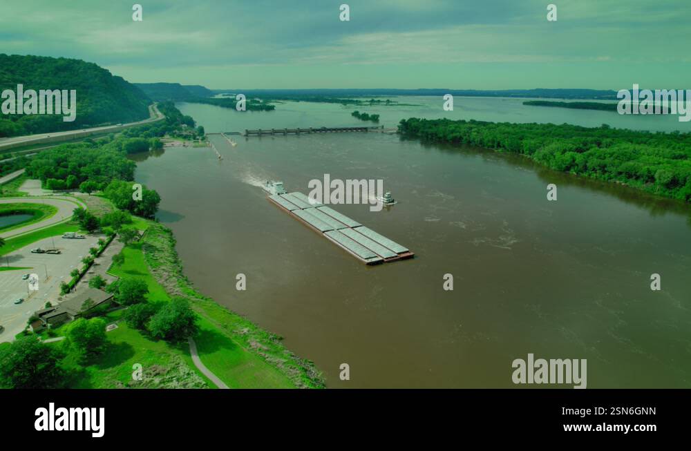 The tug boat pushed the barge, the floating platform in the Missisipi ...
