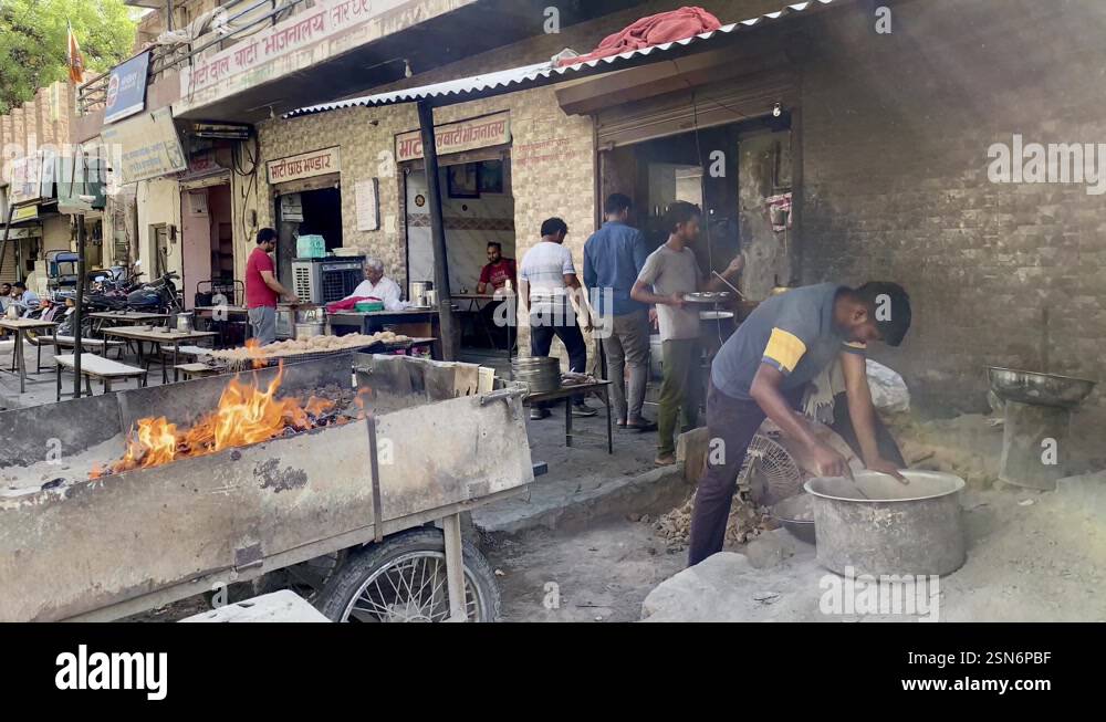 Jodhpur,India-Oct 12, 2024: Rajasthani process of bati or bafla making ...