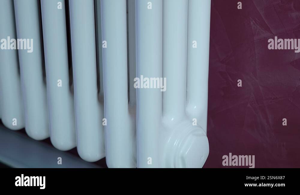 Beautiful glossy white home heating radiators under the window on the ...