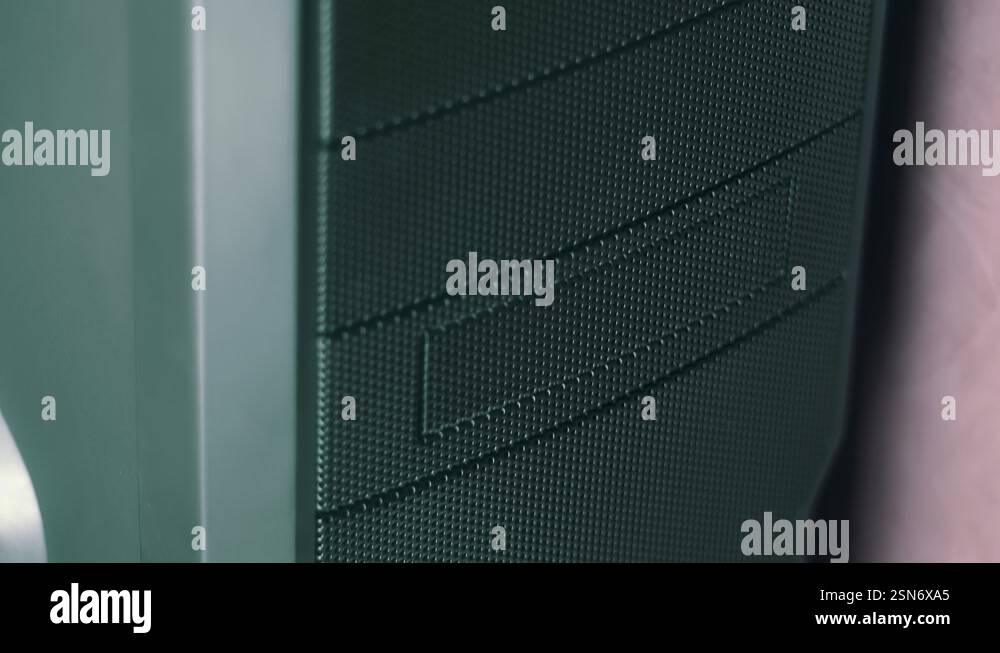 A man's finger presses the computer's system unit power button, the ...