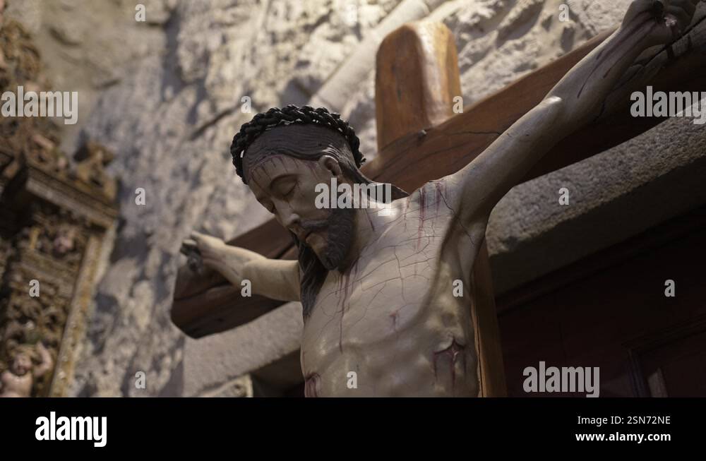 Wooden statue of Jesus Christ on the cross, depicting detailed Stock ...