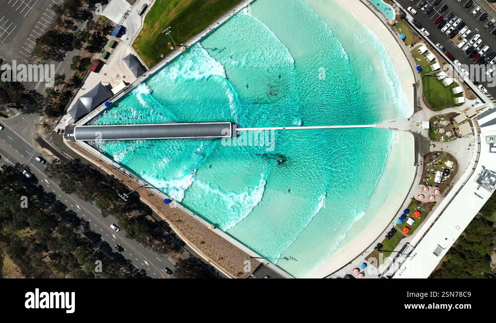 Aerial top down static view of wave pool with pulsating breaks spread ...