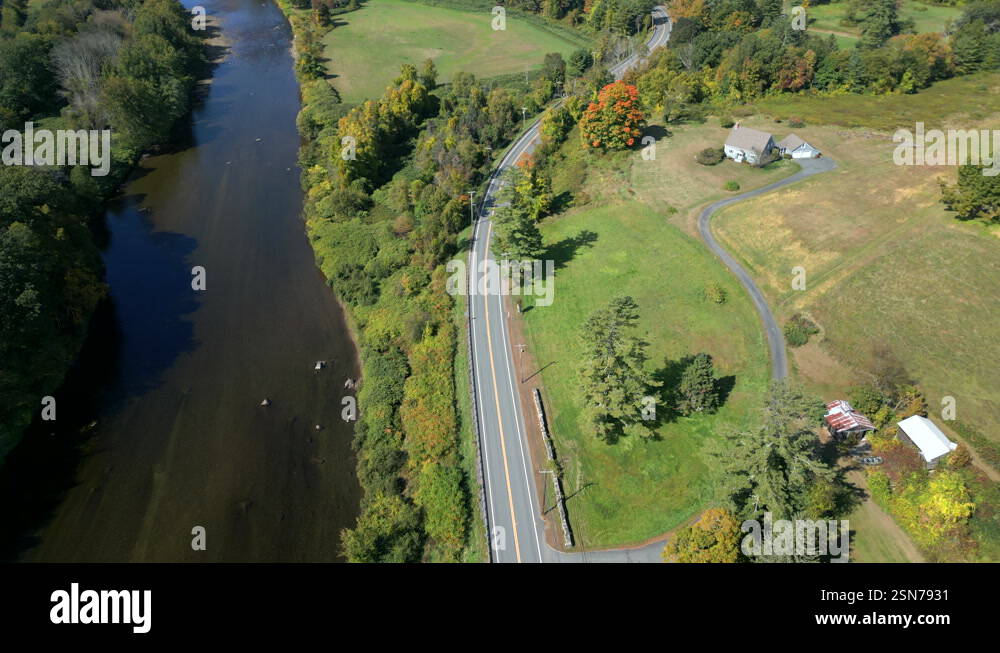 High angle aerial overview above biker group riding along Mohawk Trail ...