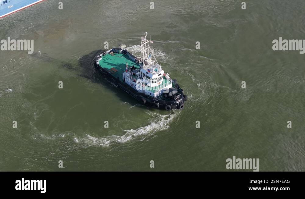 Turku, Finland - 07/06/2024: Harbour tug boat DUNKER spinning around and Stock Video Footage - Alamy
