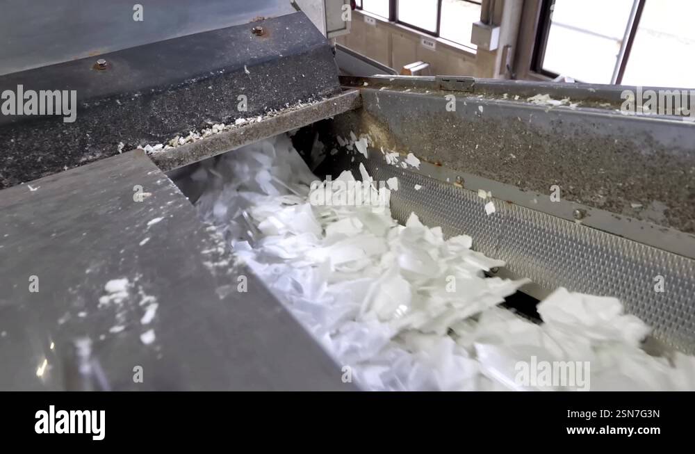 Styrofoam fragments are being transported on a conveyor system Stock ...