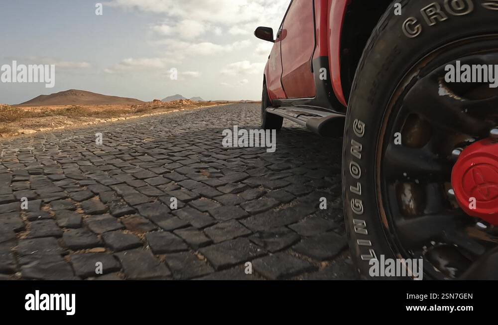 Boa Vista, Cabo Verde - 06/02/2024: Red pickup car truck drives on ...