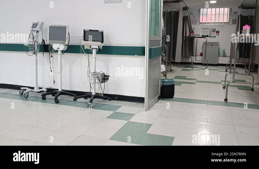 Empty hospital room with medical equipment against white walls and ...