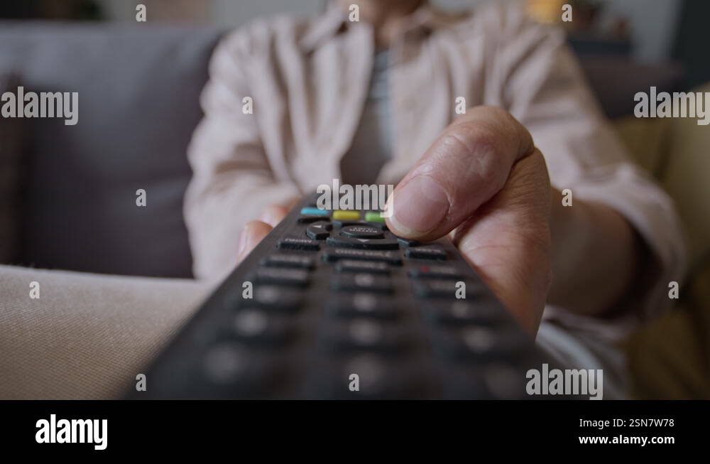 Switching Channels on Remote Control While Watching TV Stock Video ...
