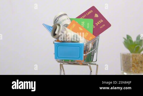 100 dollar bills in the shopping basket. close-up, spinning. Concept of ...