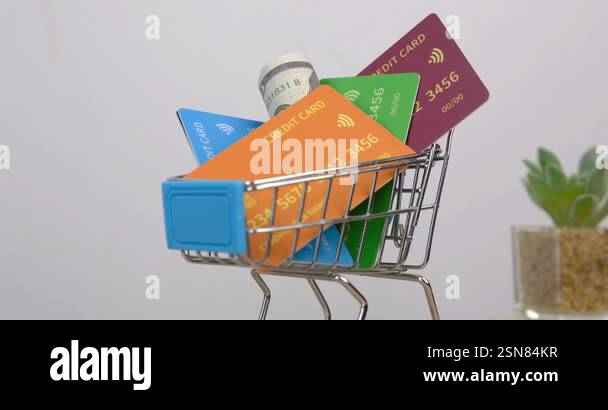 100 dollar bills in the shopping basket. close-up, spinning. Concept of ...