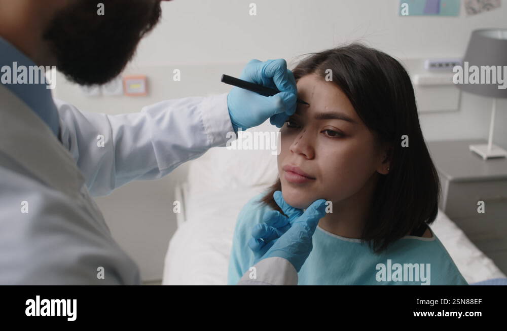 Doctor Marking Face of Gen Z Girl before Plastic Surgery in Hospital ...
