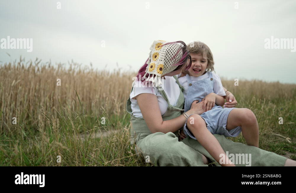 Happy Laughing Son With Mom On Field Background. Beautiful Family. Cute ...