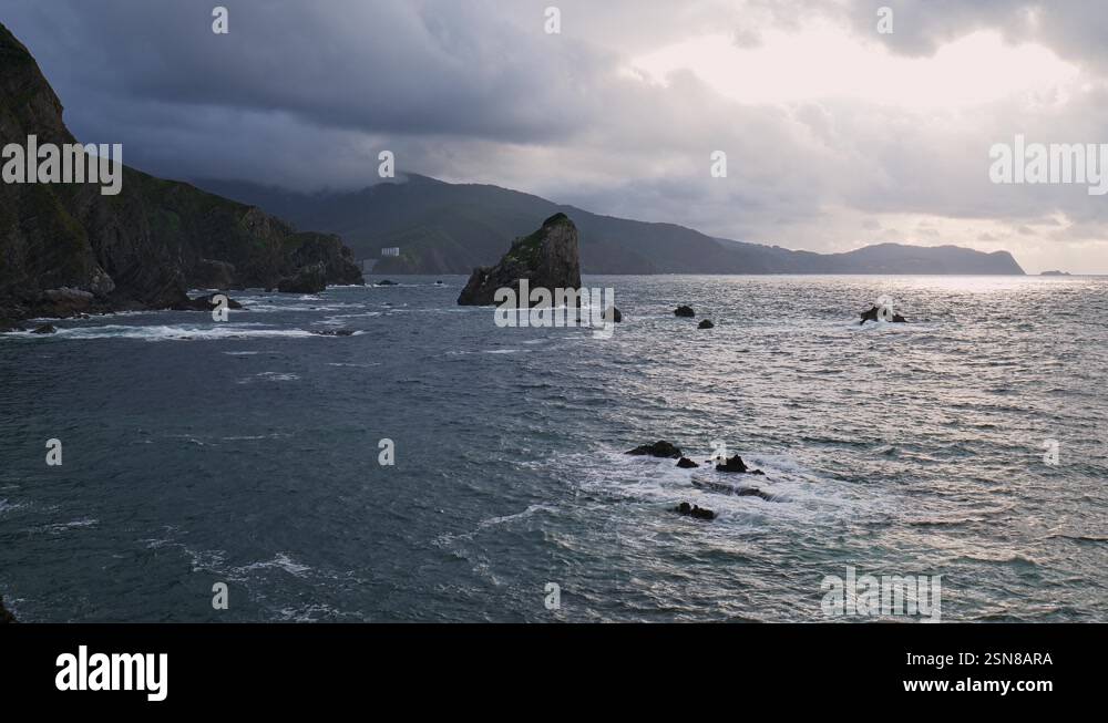 Cliff of San Juan de Gaztelugatxe on a cloudy day and rough sea. Bilbao ...