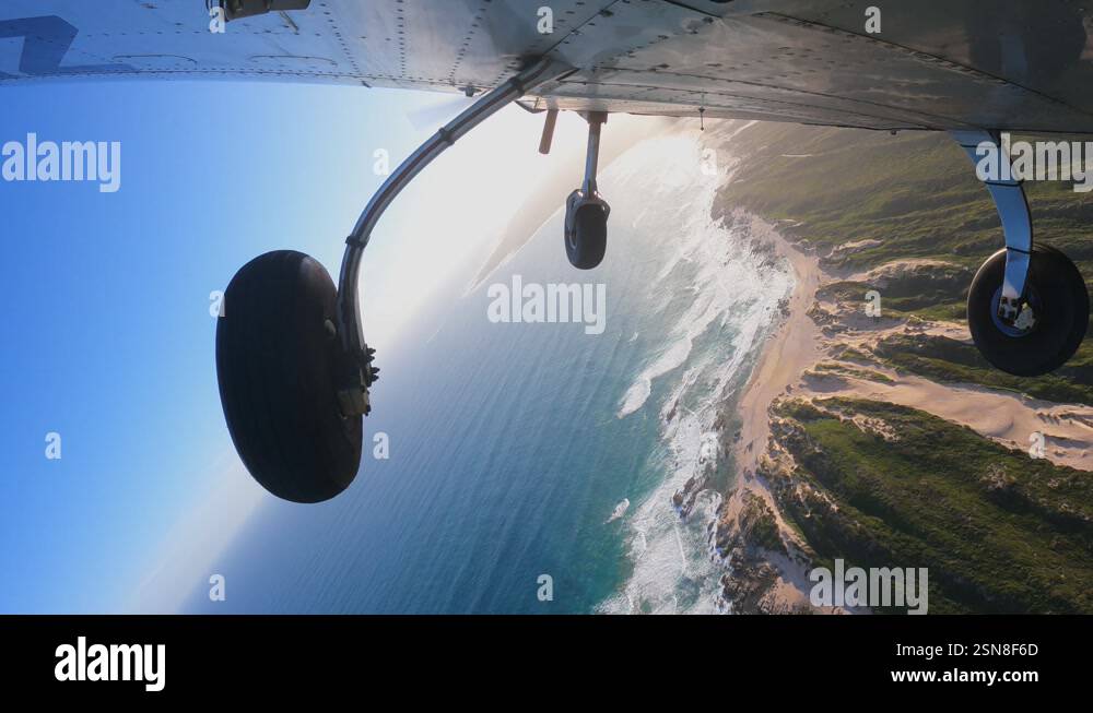 Light three wheels training airplane doing steep turns to the left and ...