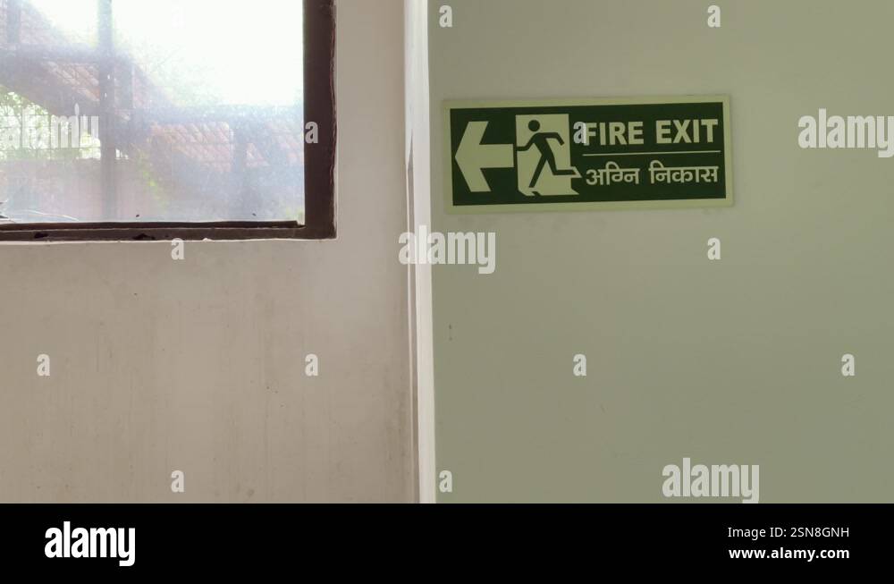 Fire Exit Sign board point the way , Green arrow with text Fire Exit ...