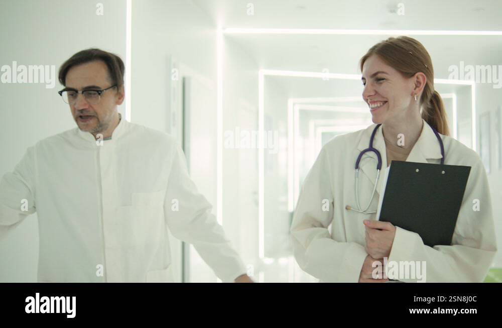 Chief Doctor Shows a Female redhaired Intern Her New Office in a Modern ...