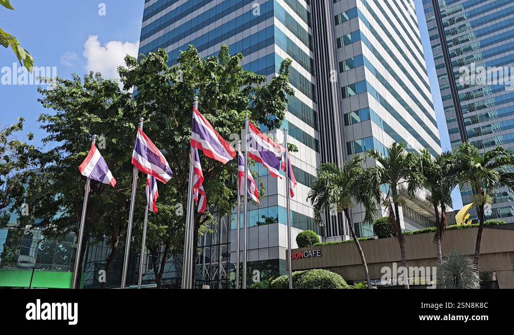 Thai Flags Waving in the Wind with Office Building in Background ...