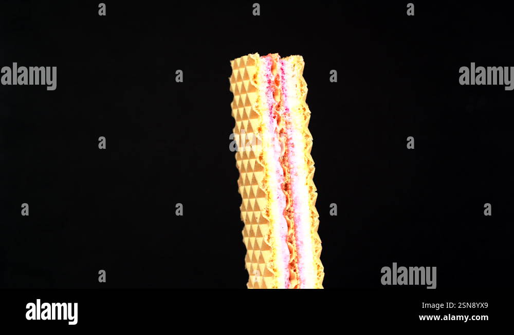 A rotating vanilla wafer bar with multiple creamy layers in between ...