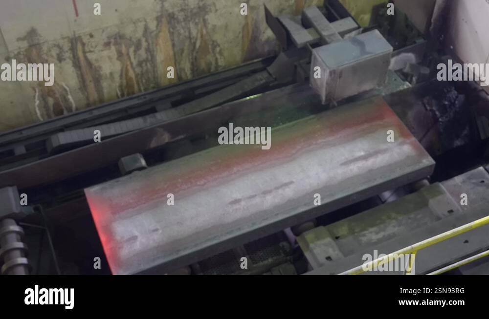 Steel production in the workshop. Metallurgy factory. Hot steel bars on ...