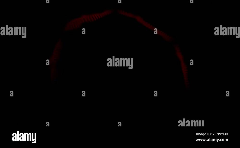 The faint blinking of an incandescent light bulb on a black background ...