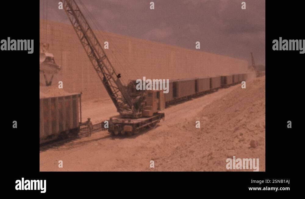 1960s: Crane fills a railroad car with sulfur. Samples of metals and ...