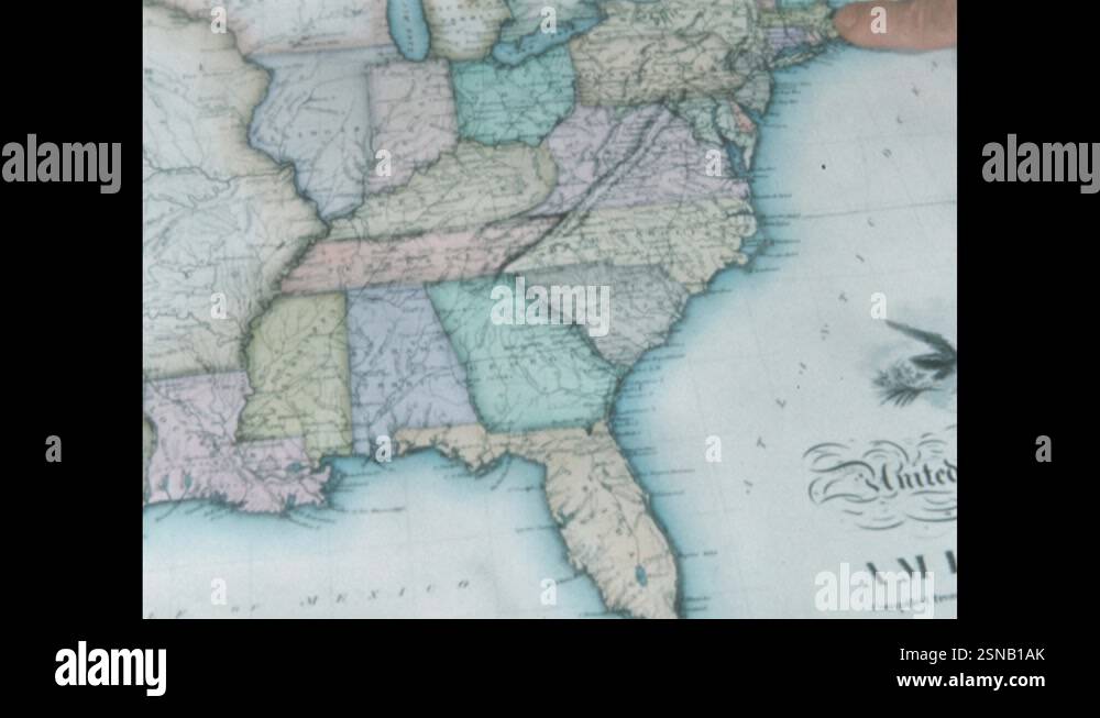 1950s: Print map of American colonies, with finger pointing to the ...
