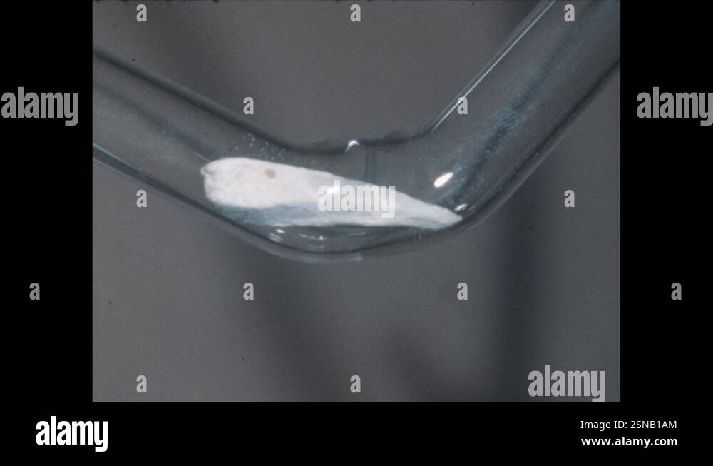 1960s: A solid white lump in the bend of a glass tube. The substance ...
