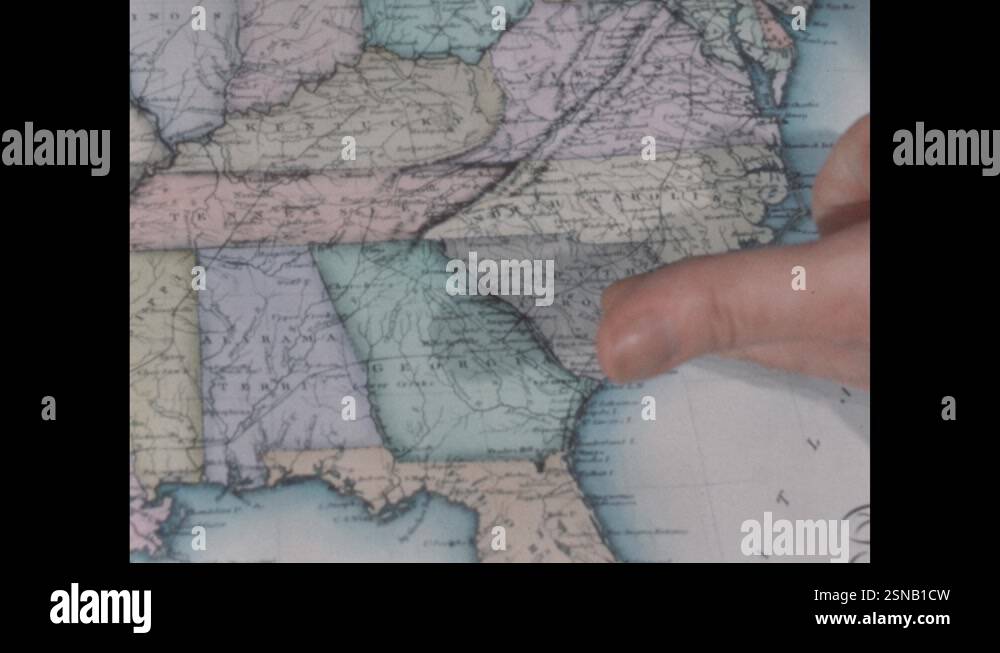 1950s: Print map of American colonies, with finger and hand pointing at ...