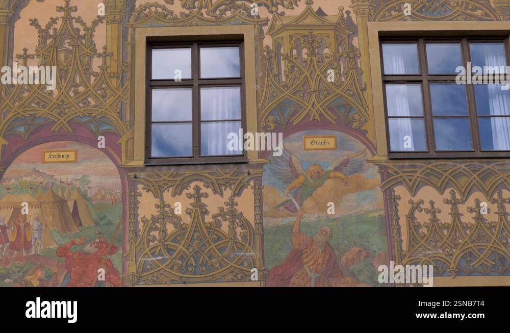 Astronomical clock on the frescoed facade of Ulm Town Hall Stock Video ...