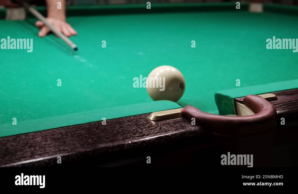 Playing Russian billiards on a green table. The professional player ...
