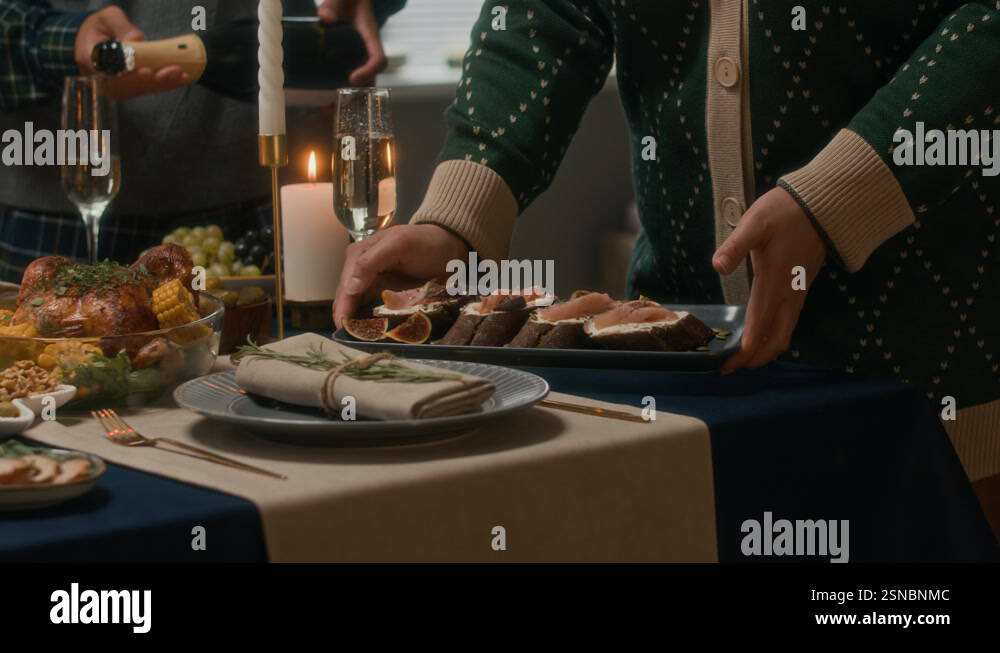 Serving Appetizer Plate on Festively Set Dinner Table and Pouring ...