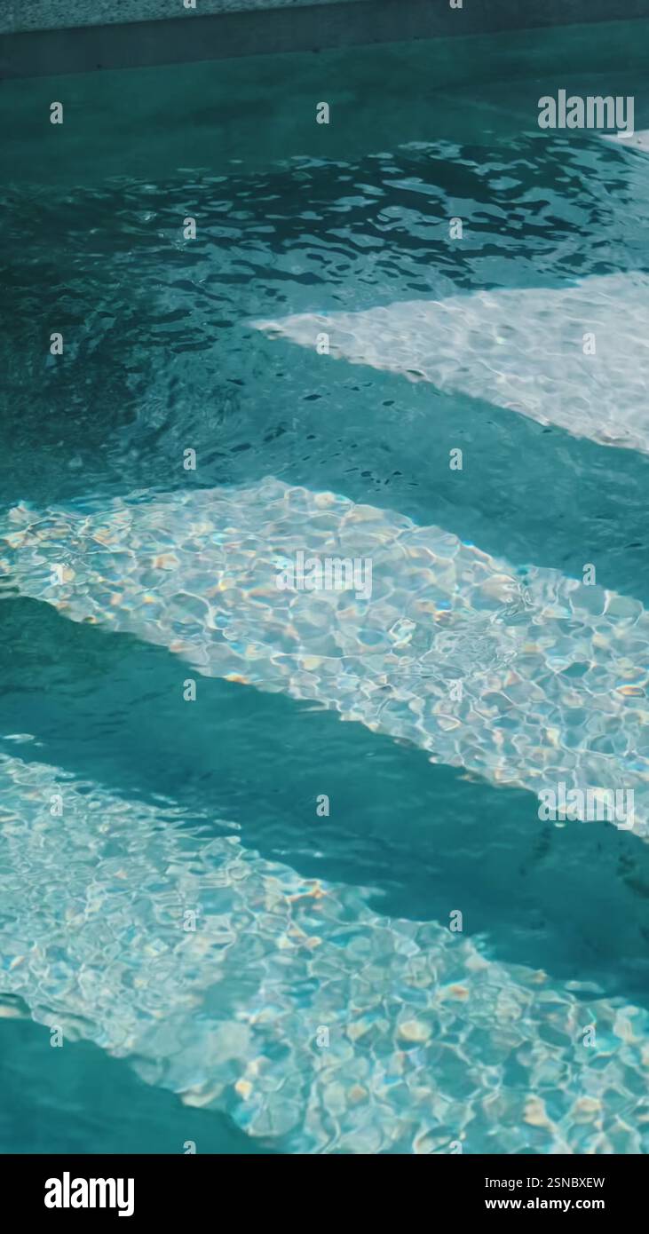 Steps in the pool with blue ceramic tile mosaic. Relax in the backyard ...