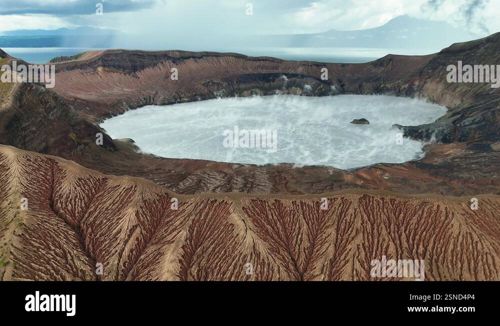 Aerial dive into the crater of Taal Volcano in the Philippines Stock ...