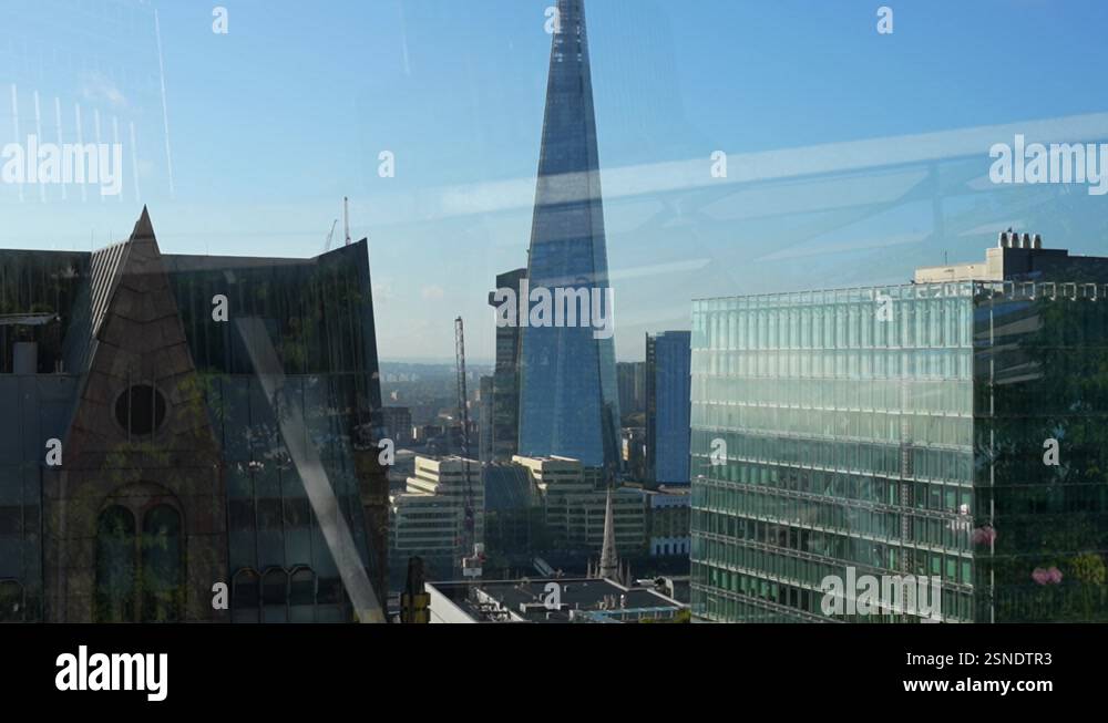 Pyramid-shaped skyscraper The Shard through glass from viewpoint in ...
