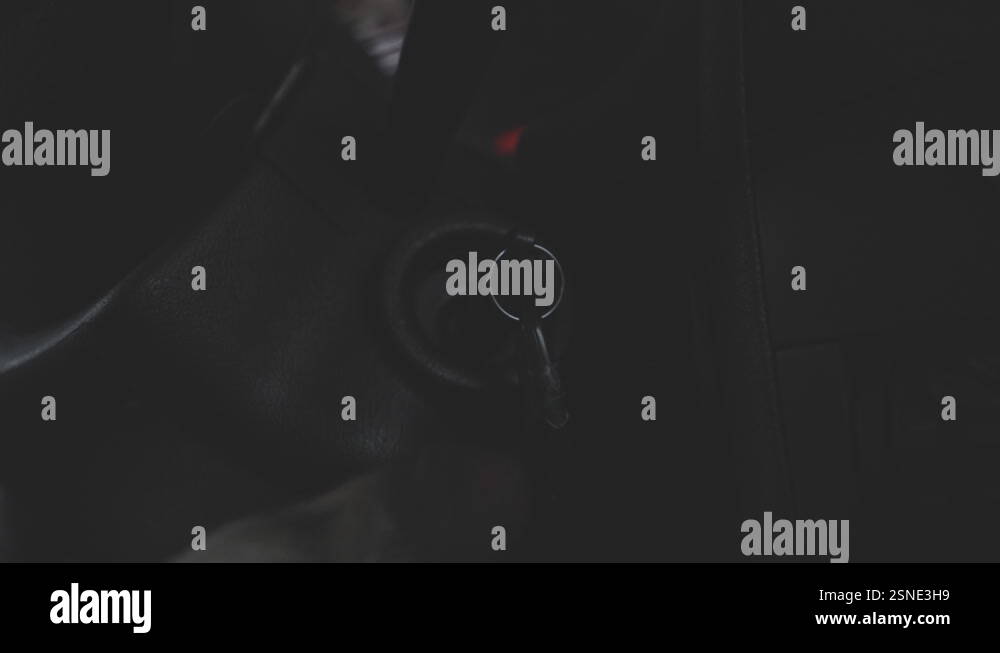 Driver inserting key and starting engine in car Stock Video Footage - Alamy