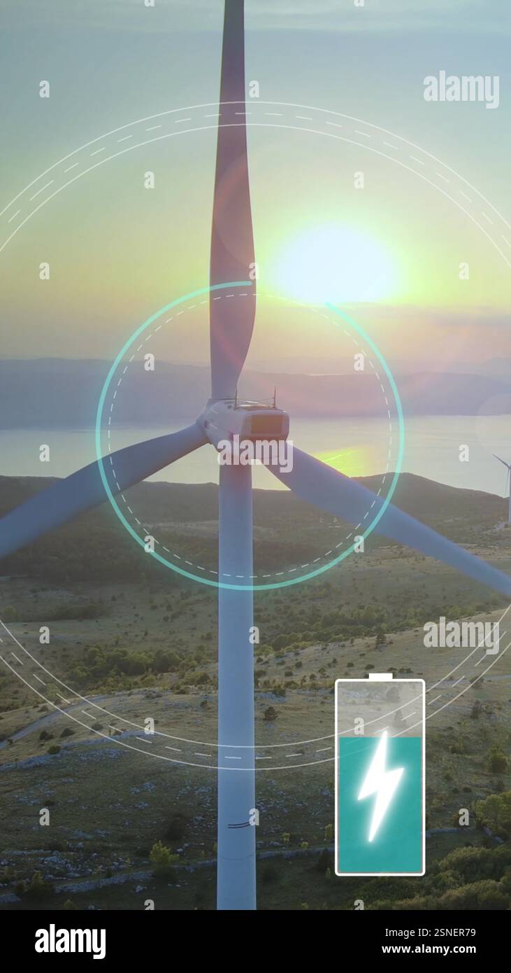 Vertical of a wind turbine at sunset with an animated overlay showing a ...