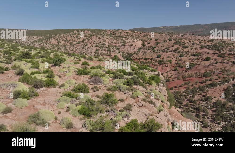 Arid landscape with rugged terrain and sparse greenery Stock Video ...