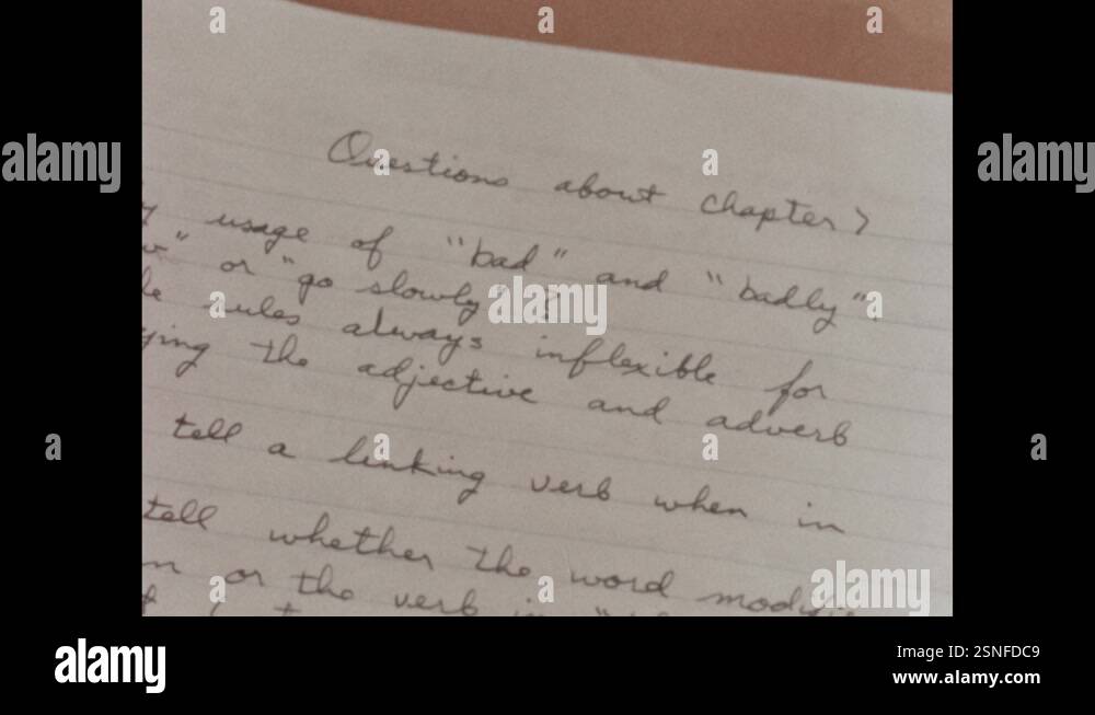1960s:Words written on lined paper. Teenage boy sits at desk in ...