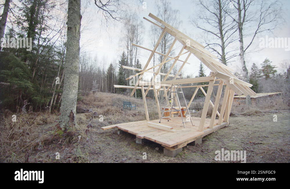 Timber structure of unfinished off grid tiny house project in woods ...