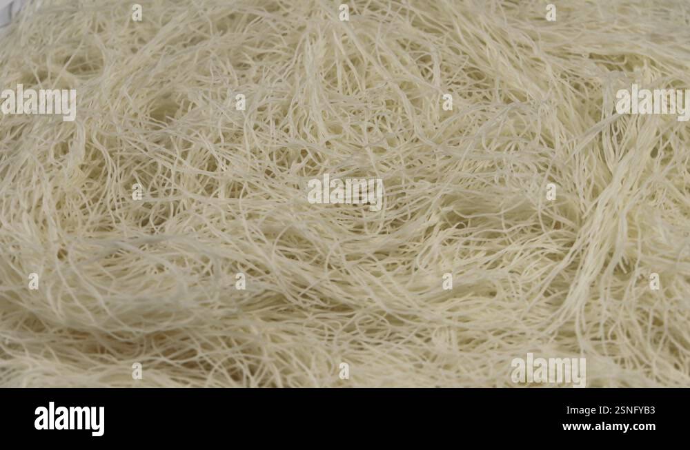 Kataifi dough, rotation in circle. shredded phyllo dough, Turning. Raw ...