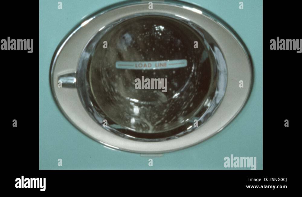 1960s: A busy laundromat features a classic washing machine spinning ...