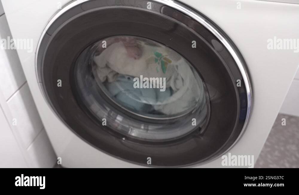 Things spinning in the washing machine drum. Washing the laundry Stock ...