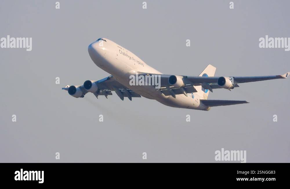 Boeing 747 jet airplane taking off in the sky with a challenge accepted ...