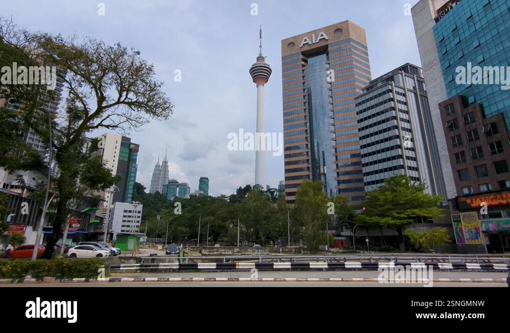 Menara KL Tower, Petronas Twin Towers, and skyscraper buildings skyline ...