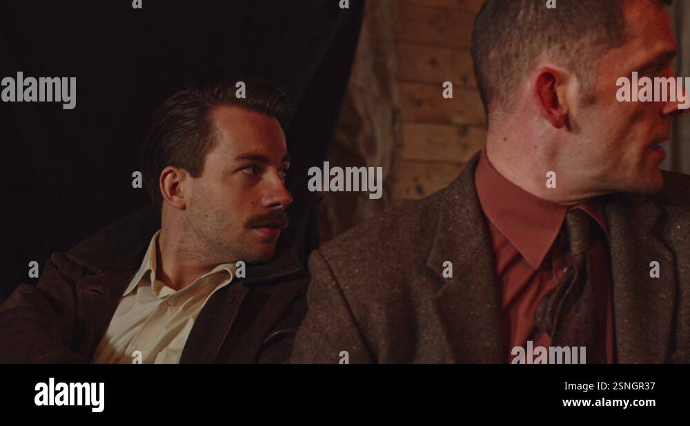 1940s World War 2 era - A civilian resistance leader sits next to a ...